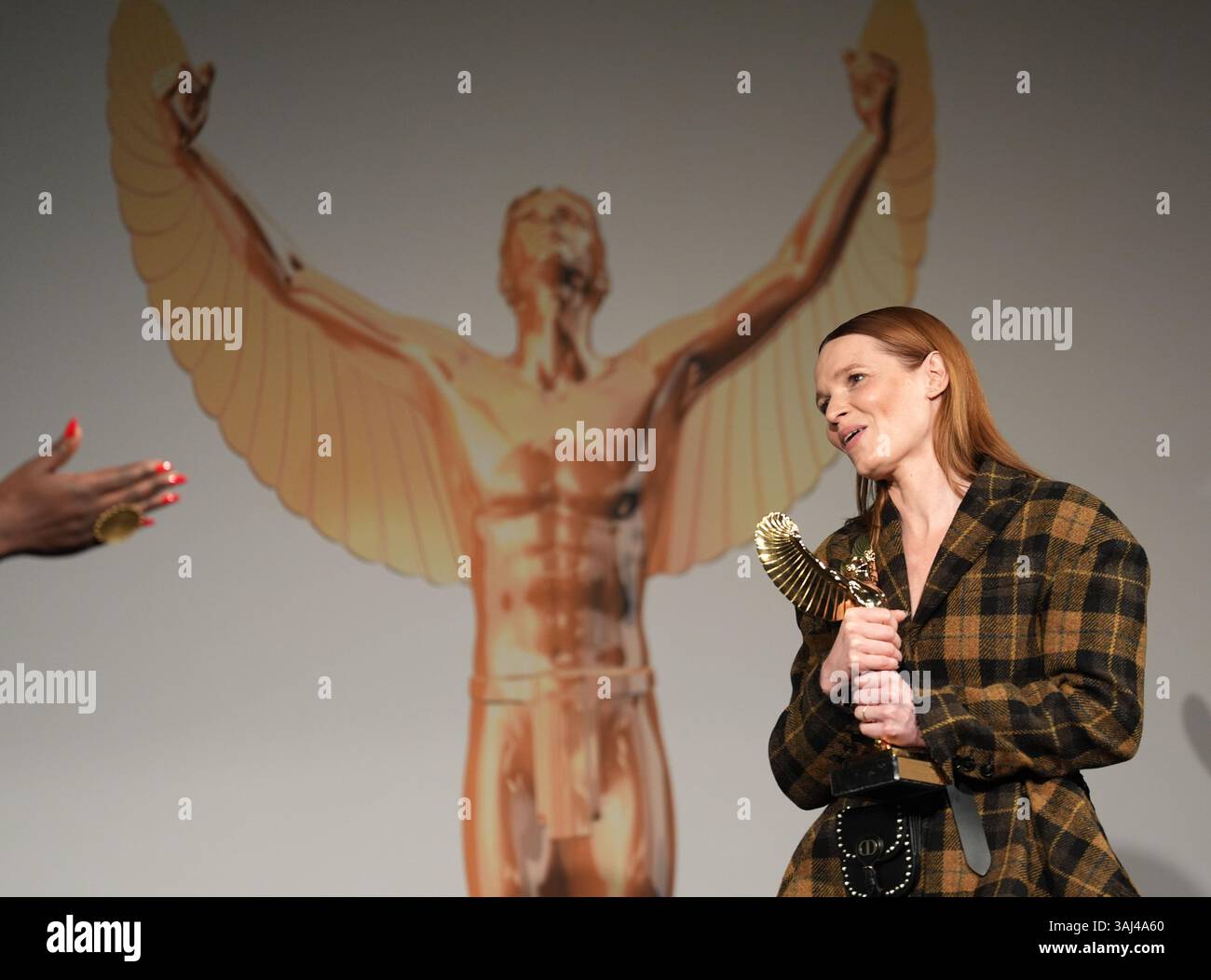 Hamburg, Germany. 10th Apr, 2025. Karoline Herfurth, actress, holds up ...