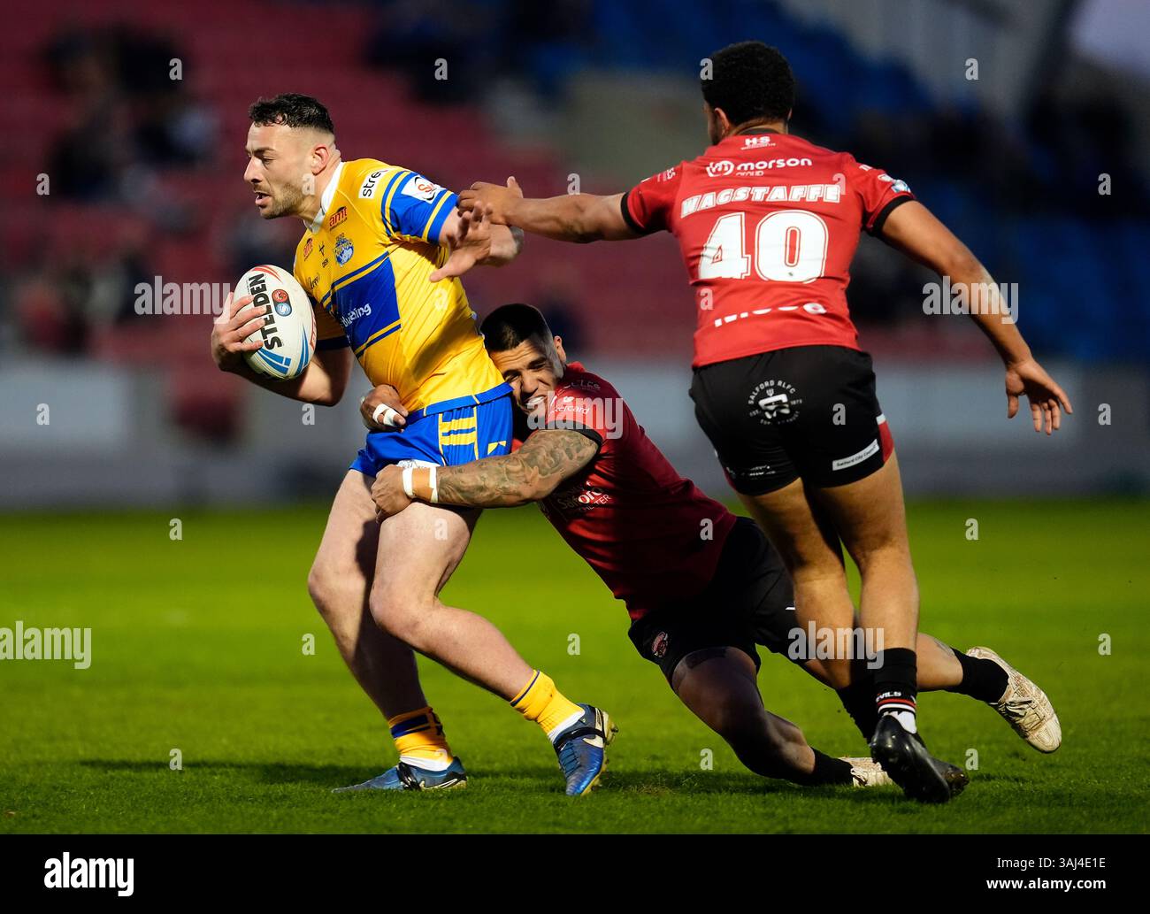 Leeds Rhinos' Jake Connor is tackled during the Betfred Super League ...