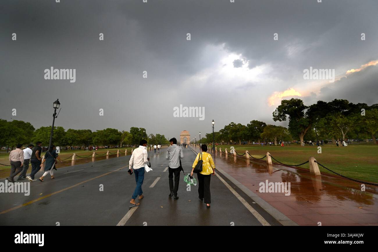 NEW DELHI, INDIA - APRIL 10: Visitors during sudden rain at Kartavya ...