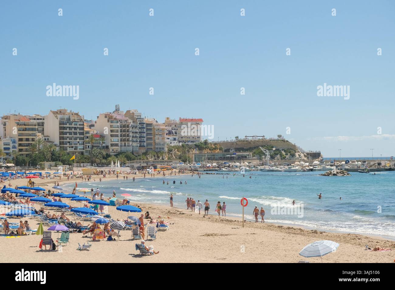 Benidorm, Spain - April 7, 2025: Benidorm beach full of people relaxing ...