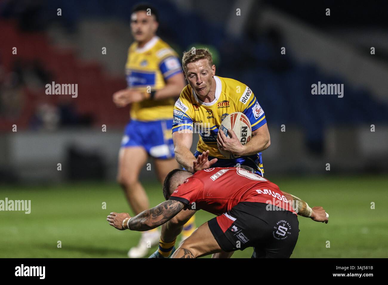 Eccles, UK. 10th Apr, 2025. Lachlan Miller of Leeds Rhinos is tackled ...