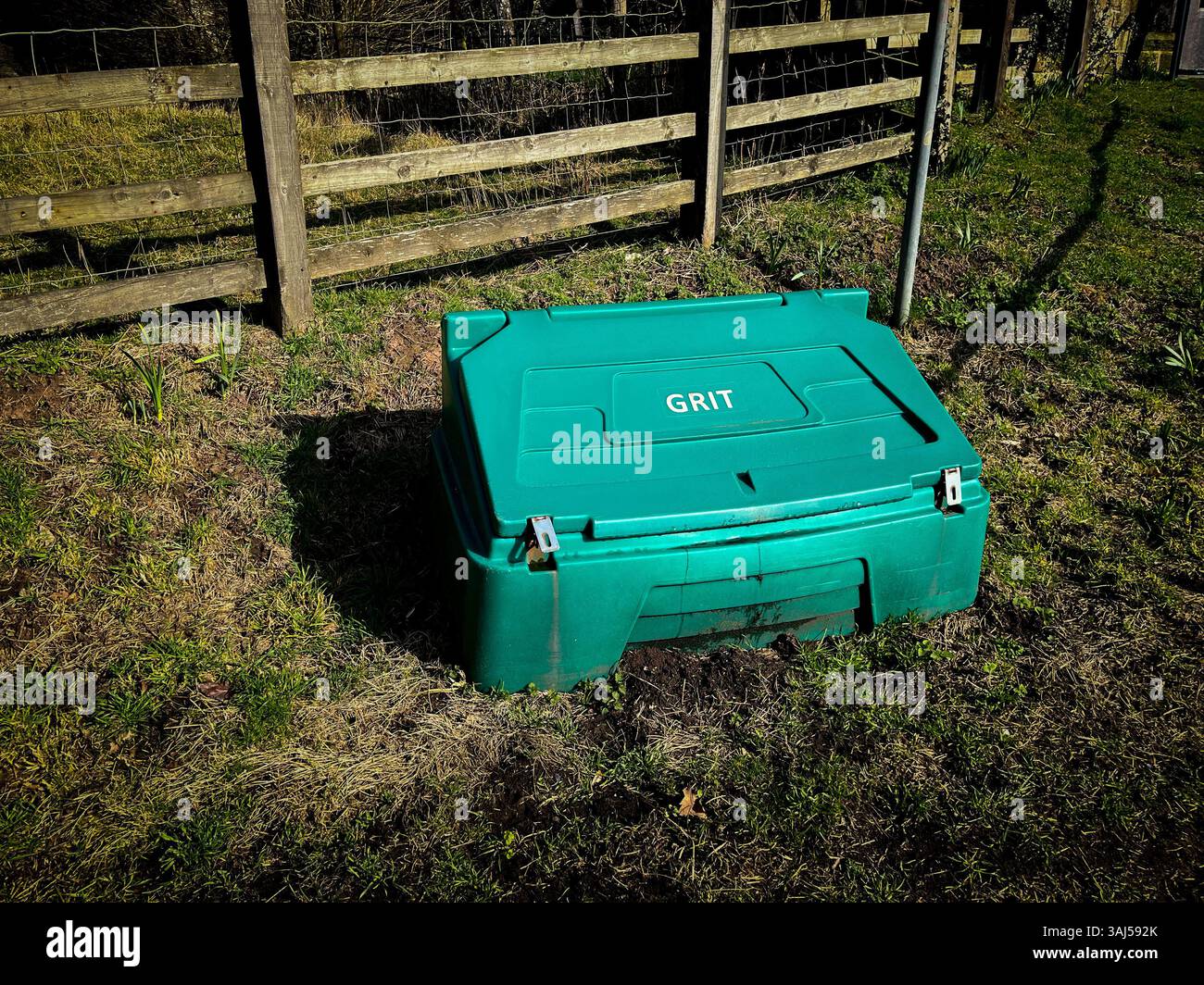 Green box on roadside grass verge containing road grit for winter ice ...