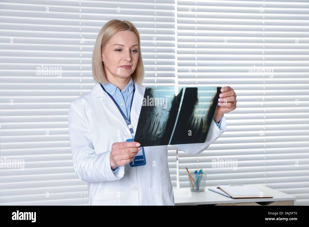 Doctor examining foot x-ray near window in clinic Stock Photo - Alamy