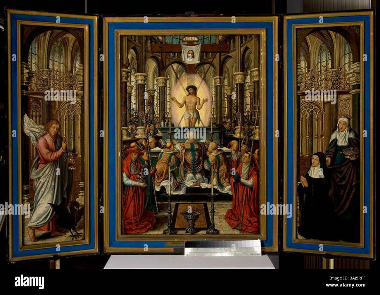 A triptych featuring the Mass of St. Gregory, St. John the Evangelist, and St. Elisabeth of ...