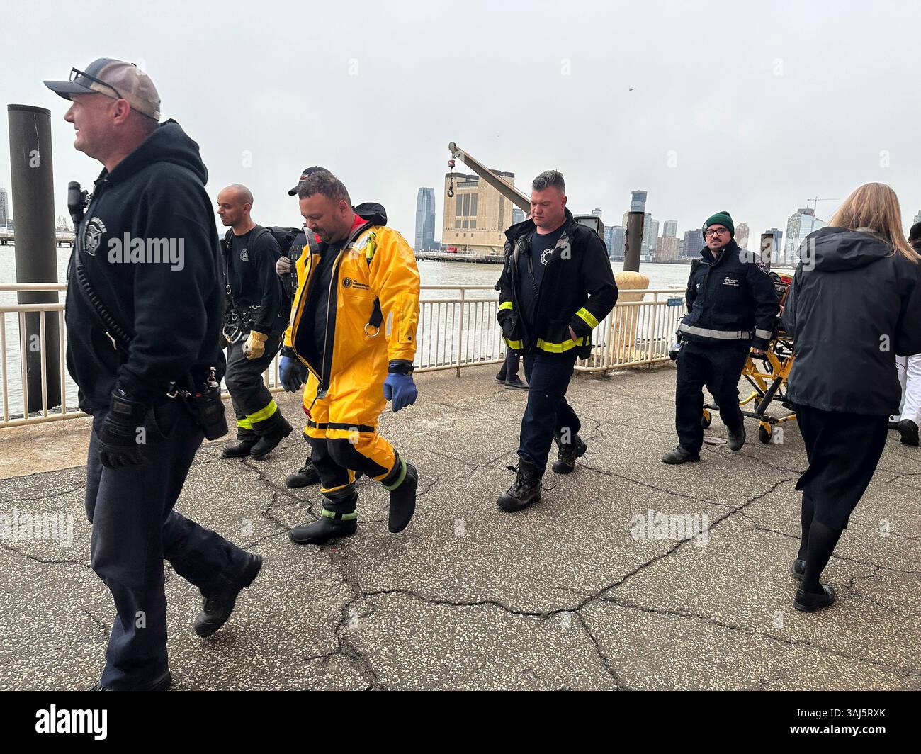 First responders walk along Pier 40, Thursday, April 10, 2025, in New ...