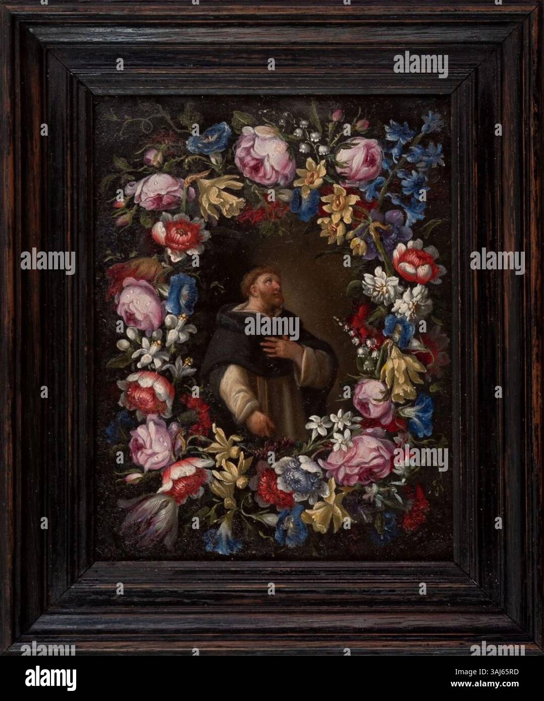 This painting attributed to Jan Pieter Brueghel portrays a monk surrounded by a wreath of ...