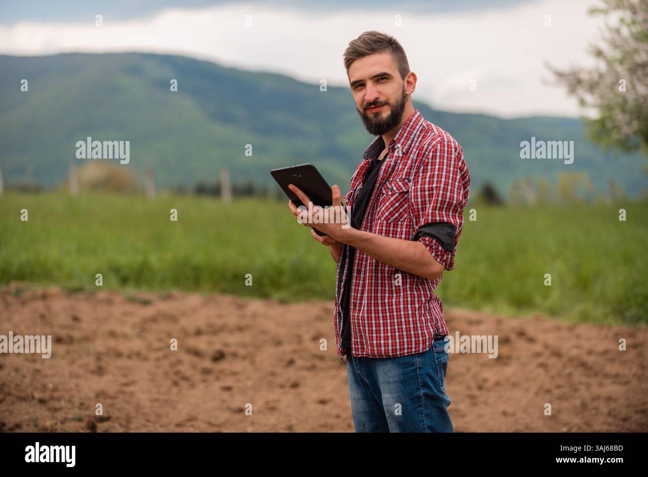 Male farmer plantation checking quality by tablet agriculture modern ...