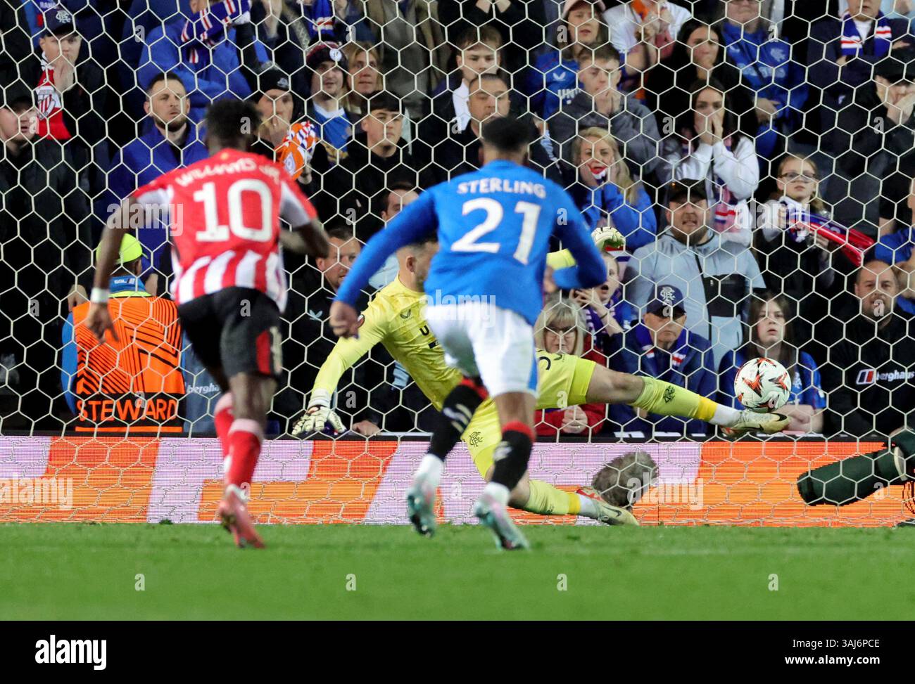 Rangers goalkeeper Liam Kelly saves a penalty during the UEFA Europa ...