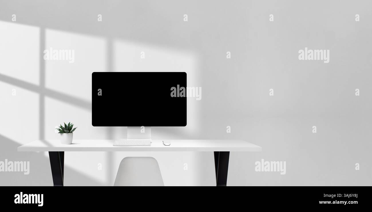 Bright office desk with computer monitor, keyboard, mouse, and plant ...