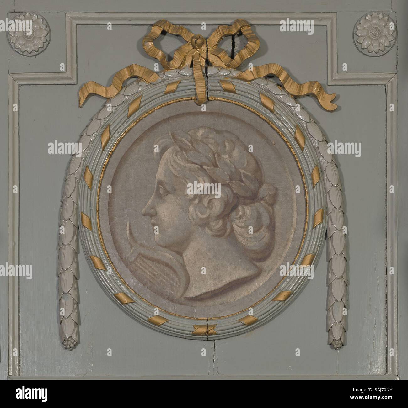 This grisaille painting, created in 1776, depicts Apollo in a medallion ...