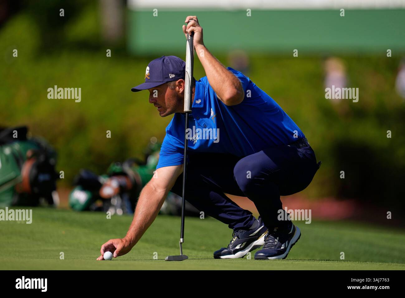 Bryson DeChambeau lines up a putt on the 10th hole during the first ...