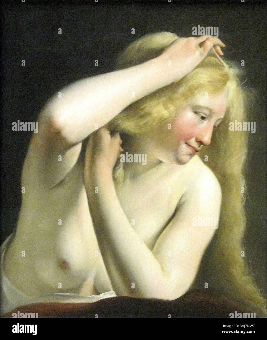 Salomon de Bray’s 1630-1635 oil on panel, 'Young Woman Combing Her Hair', depicts a typical ...