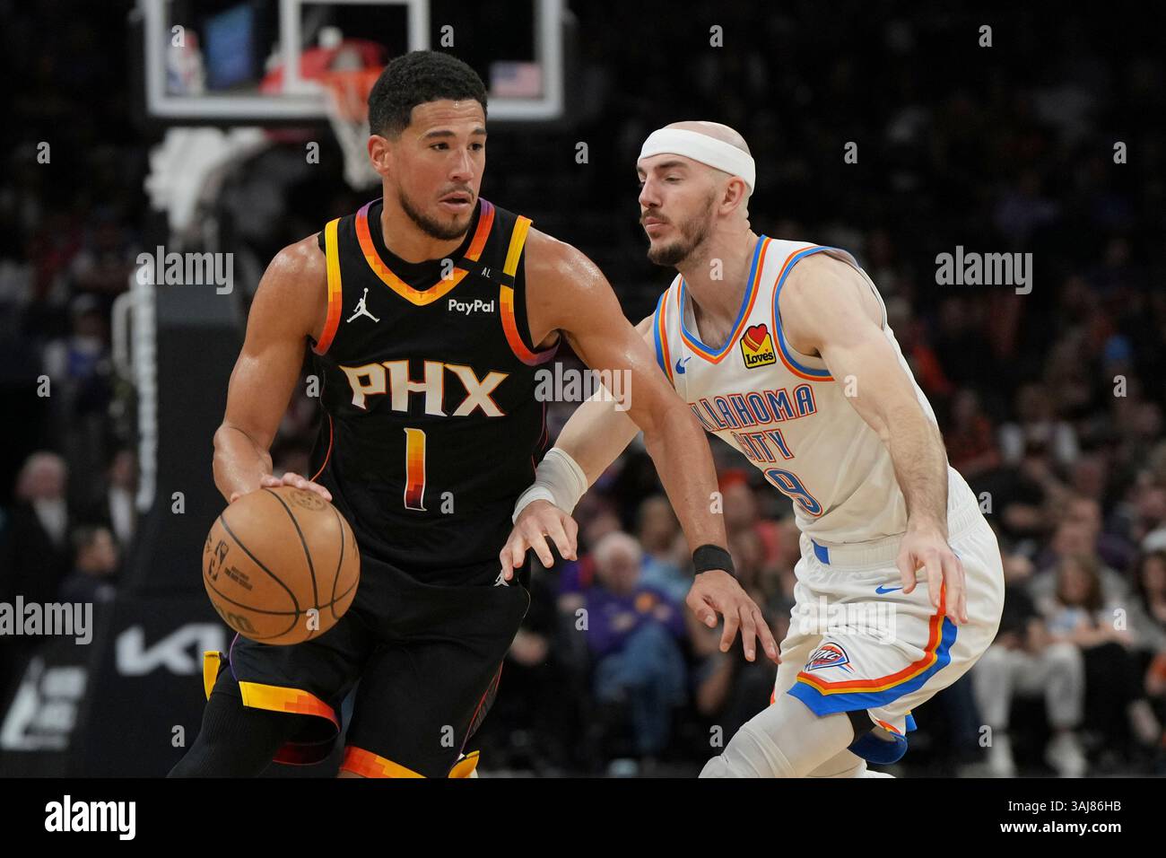 Phoenix Suns guard Devin Booker (1) against the Oklahoma City Thunder ...