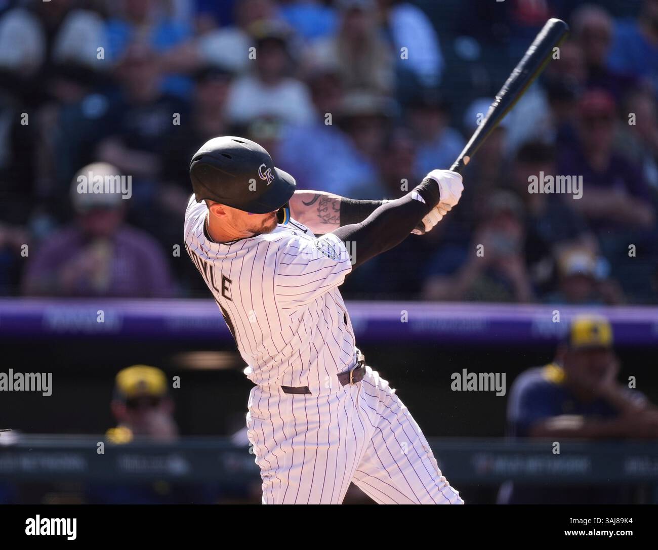 Colorado Rockies' Brenton Doyle connects for a double to drive in three ...