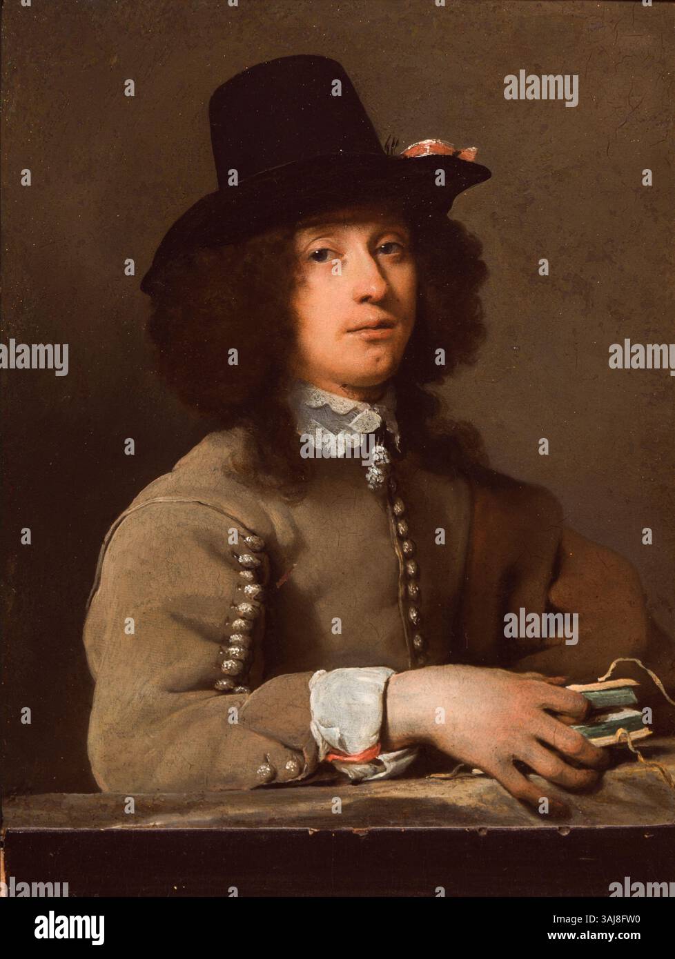 Portrait of a young man with a hat holding a book, attributed to ...