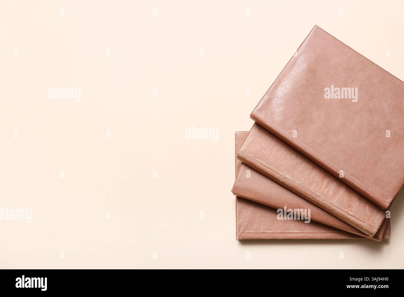 Ladder made of books on beige background Stock Photo - Alamy