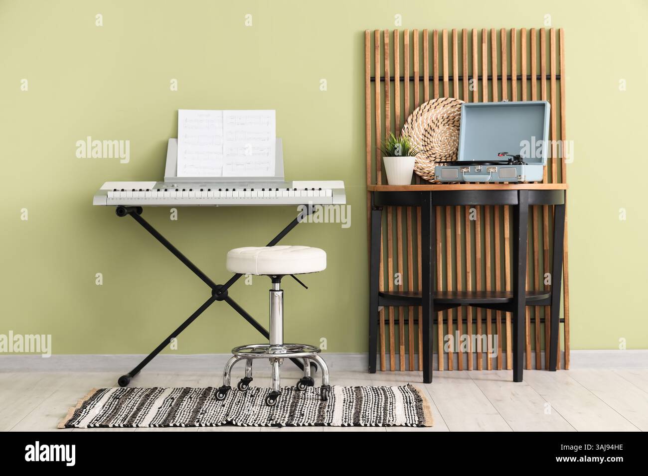 Interior of room with synthesizer, table and folding screen Stock Photo ...
