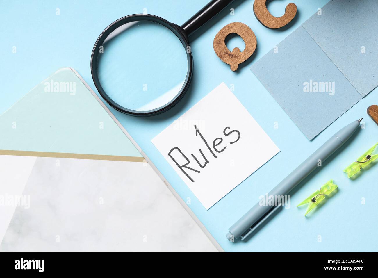 Paper with word RULES and stationery on blue background Stock Photo - Alamy