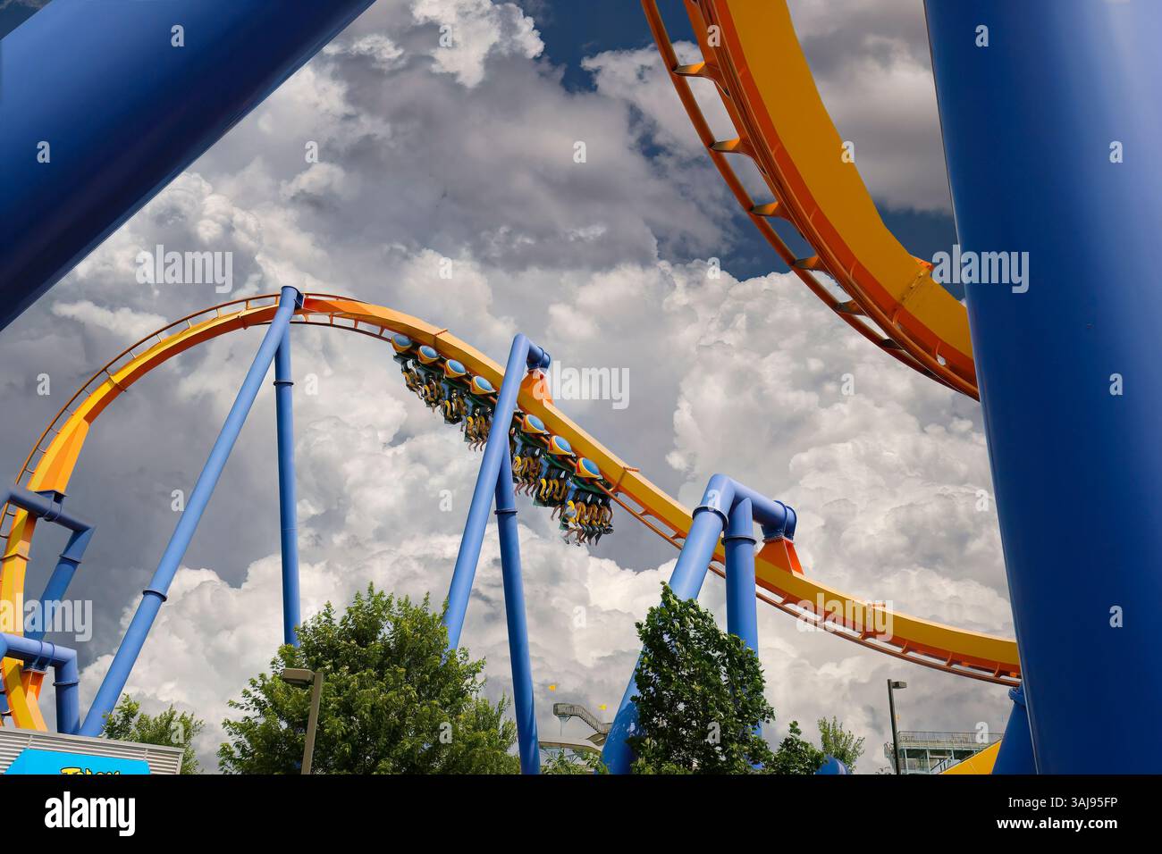 Roller Coaster Rides at Theme Park Stock Photo - Alamy
