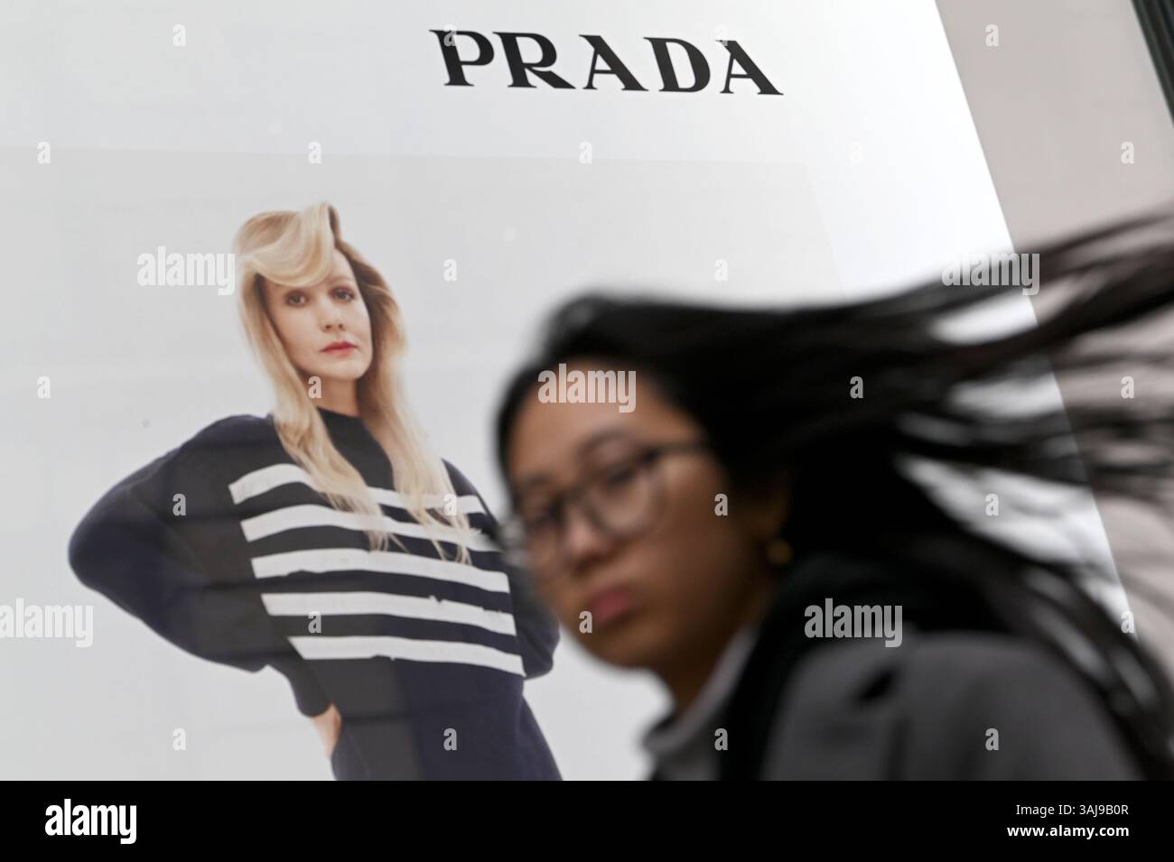 New York, USA. 10th Apr, 2025. People walk past the Prada retail store ...
