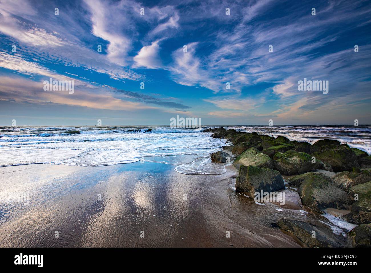 Coastal defense by breakwaters on the North Sea shore, Netherlands ...