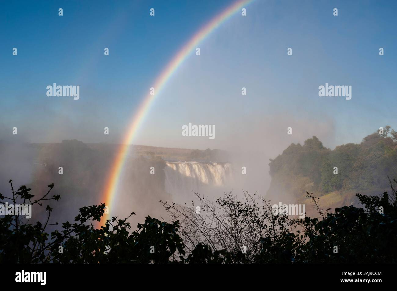A double rainbow over misty Victoria Falls, Zimbabwe, Victoria Falls ...