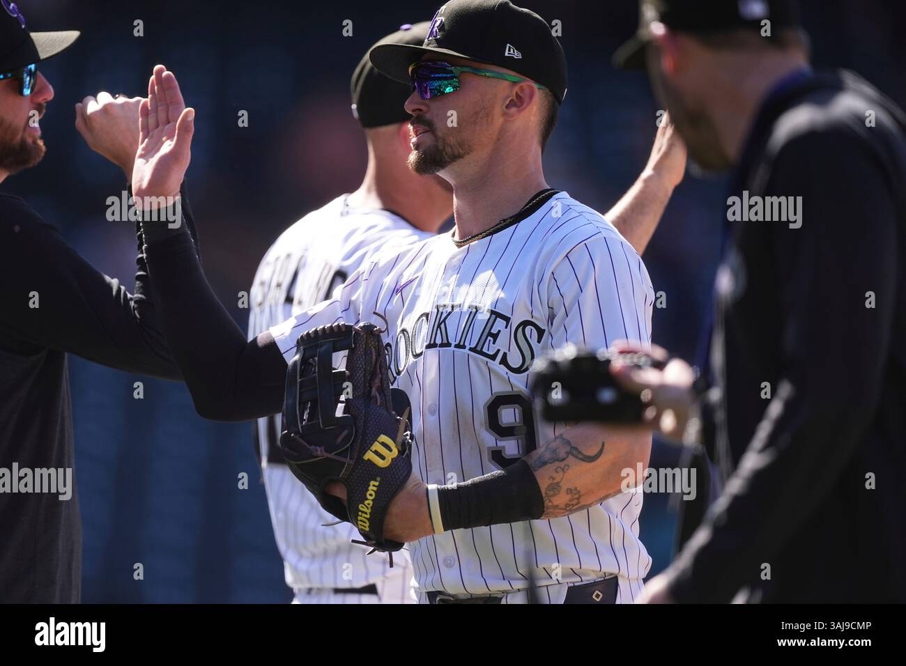 Colorado Rockies' Brenton Doyle is congratulated after a baseball game ...