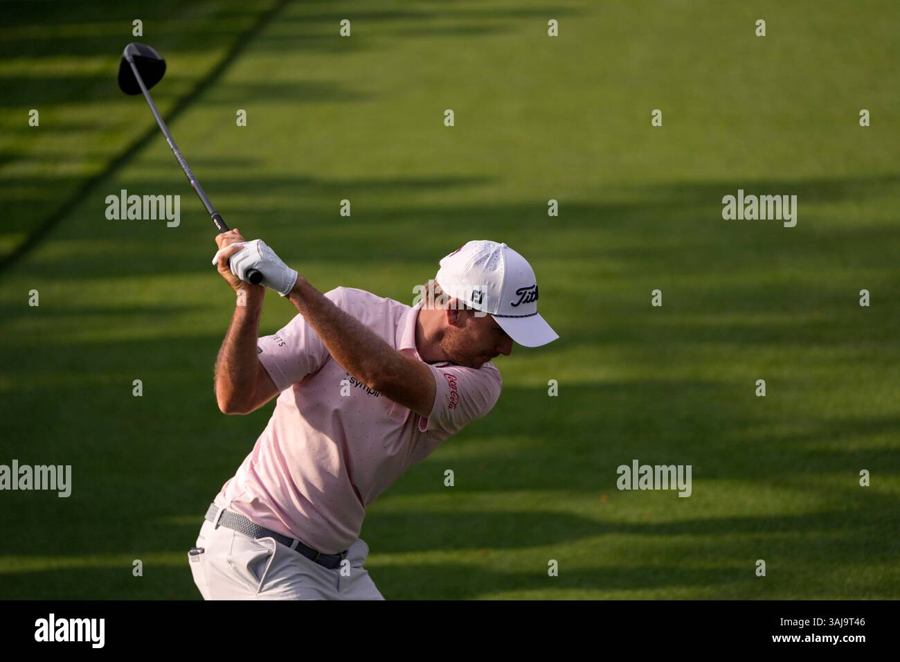 Russell Henley hits his tee shot on the 18th hole during the first ...