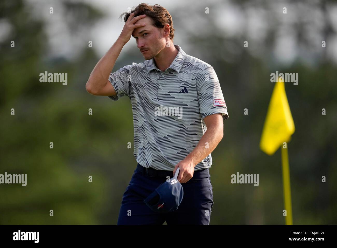 Rasmus Hojgaard, of Denmark, walks off the green on the 18th hole during the first round at the ...