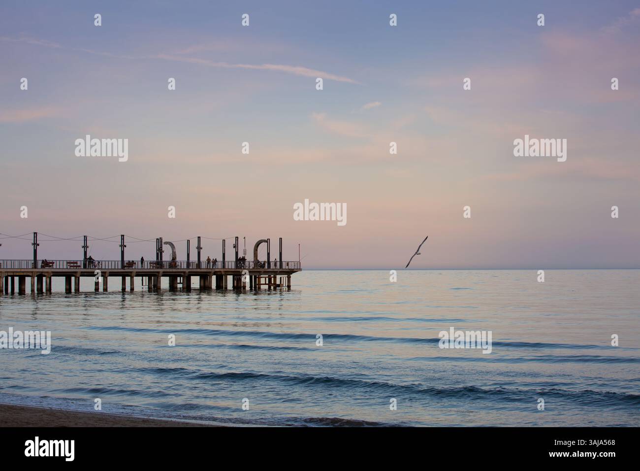 Bridge del Molo Mario Bestoso, with Laigueglia in the background, in a ...