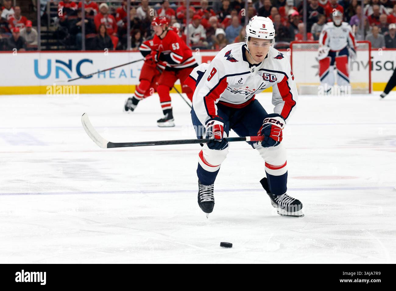 Washington Capitals' Ryan Leonard (9) chases the puck against the Carolina Hurricanes during the ...