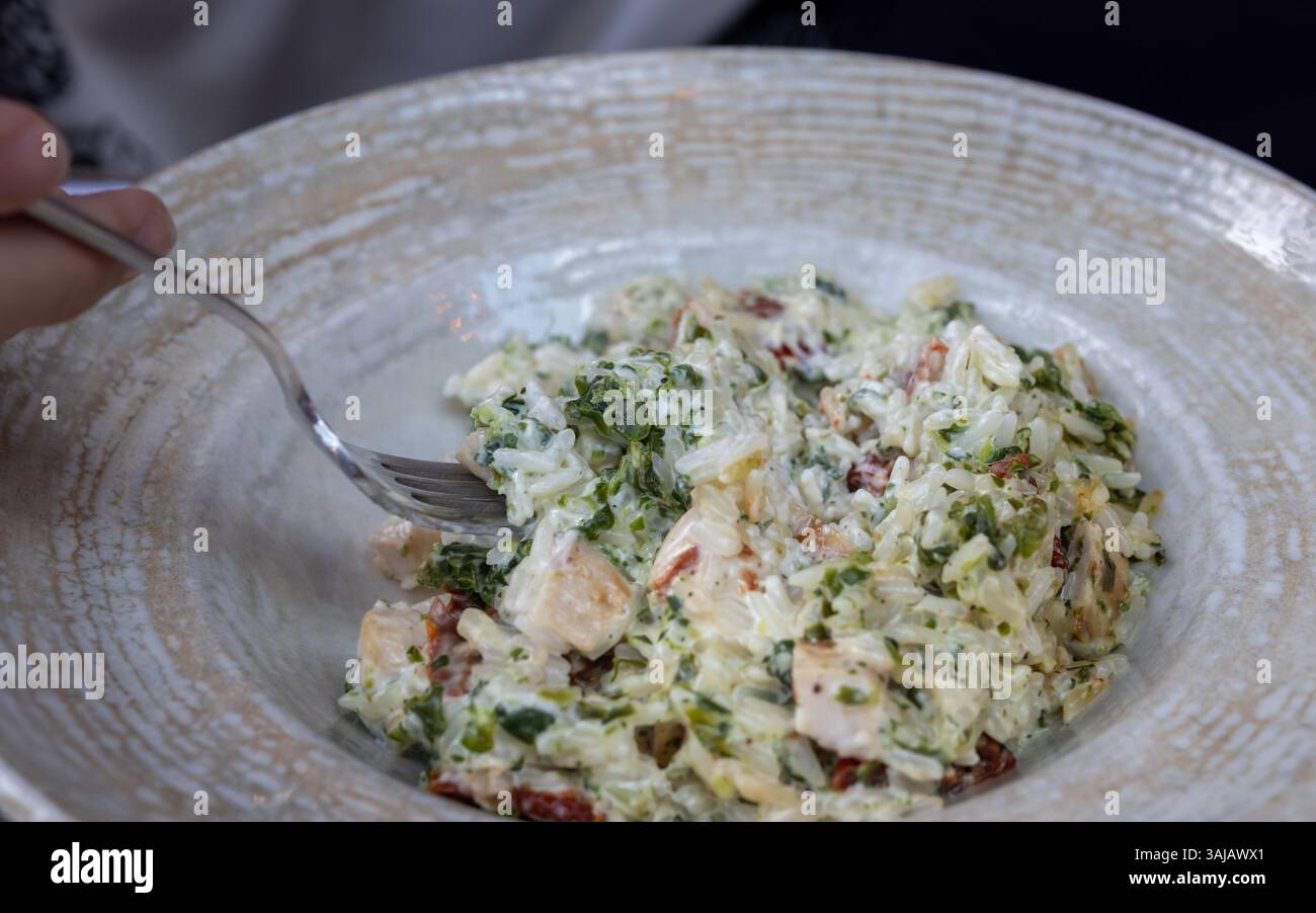 Creamy chicken and spinach risotto Stock Photo - Alamy