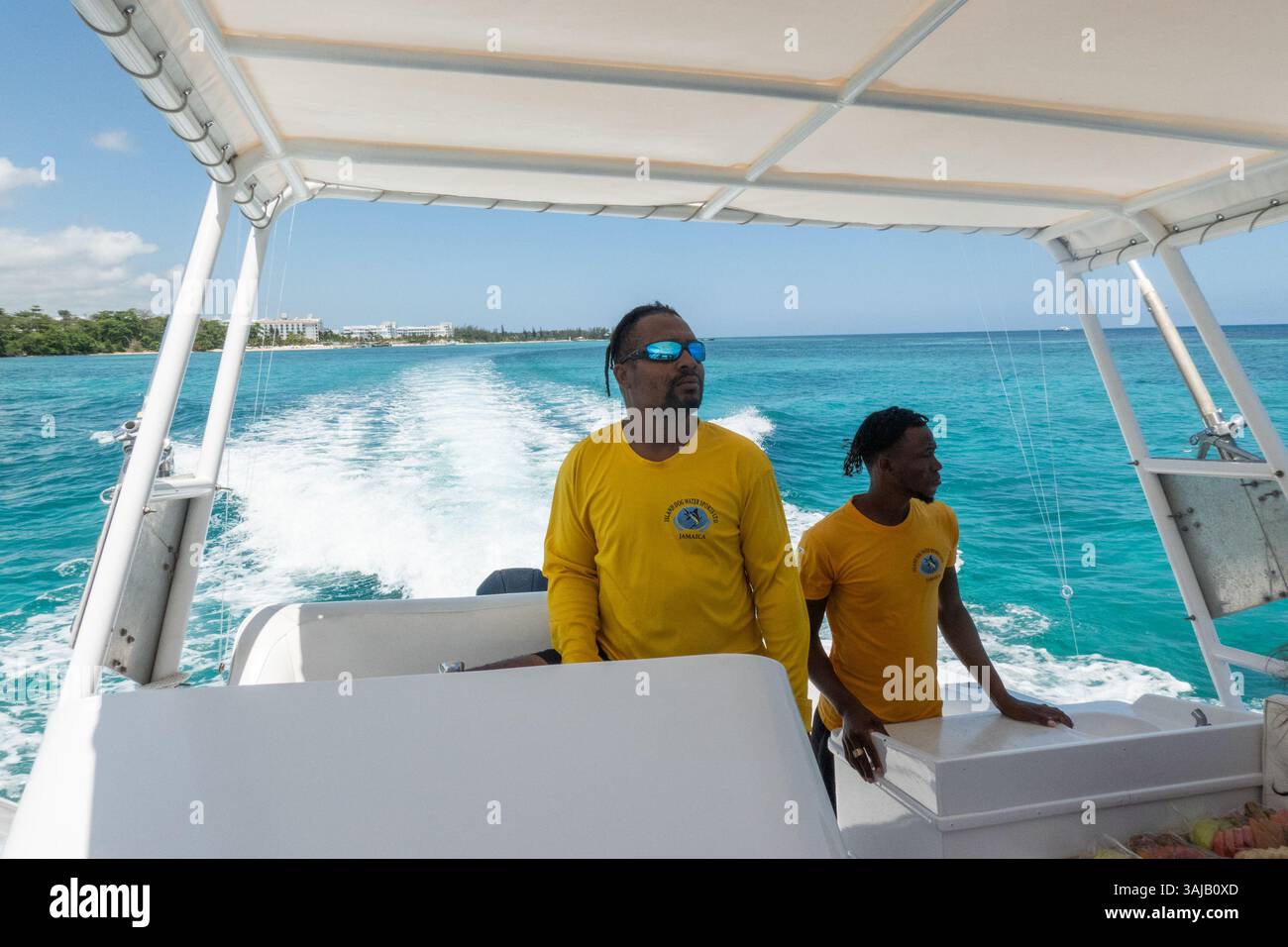 Ocho Rios, Jamaica. 10th Apr, 2025. A pair of tour boat operators in ...