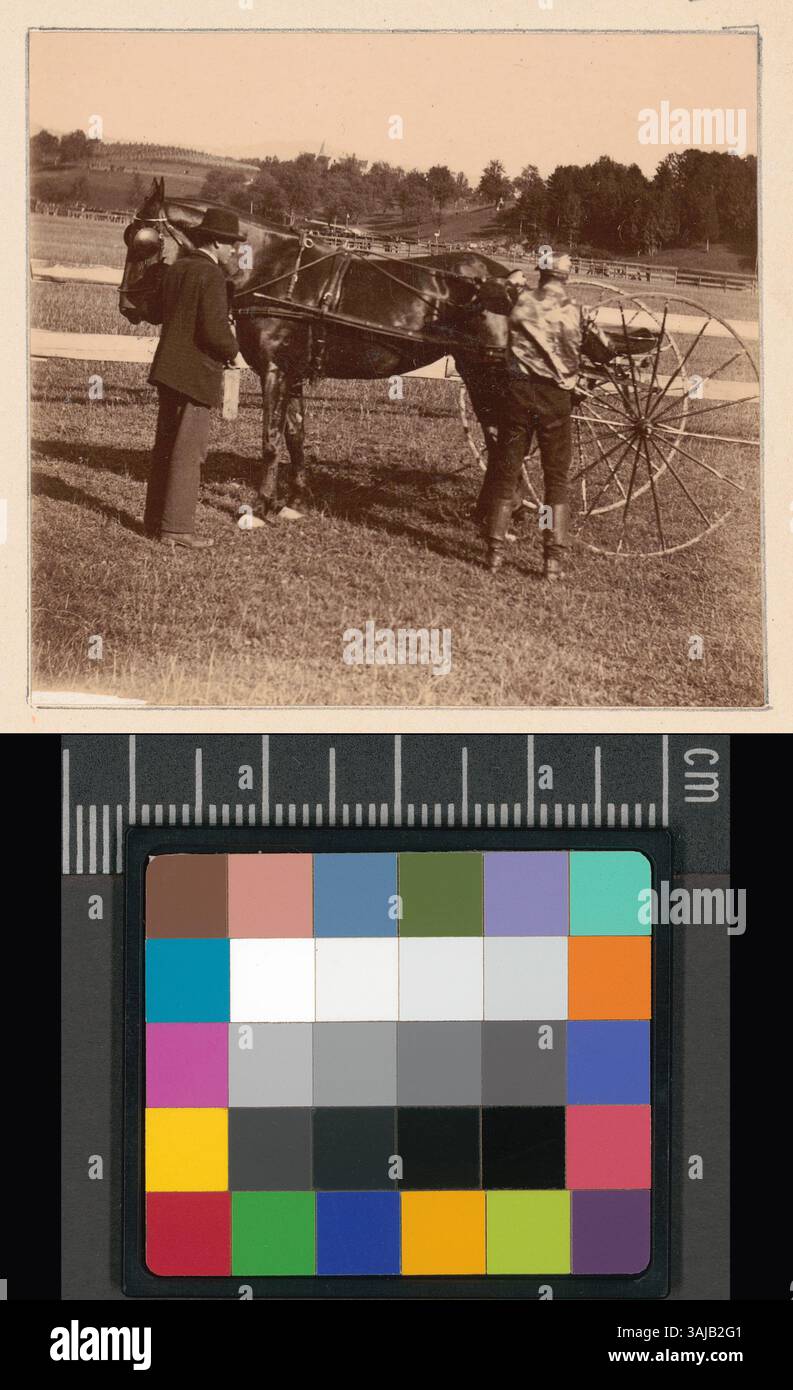 This 1891 photo shows two men standing beside a racehorse and a racing ...