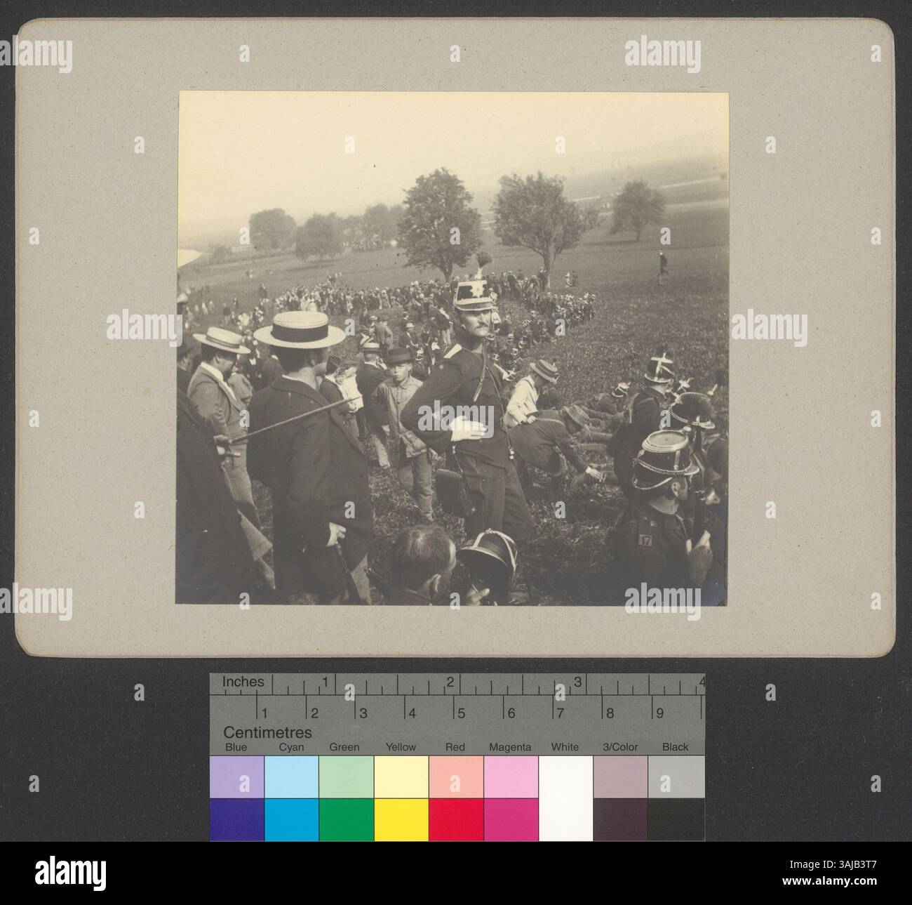 The image depicts military infantry soldiers and spectators on a field ...