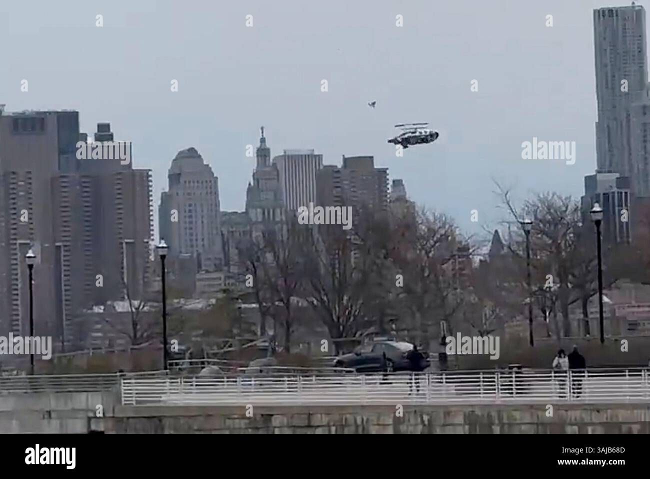 In this photo taken from video, a helicopter falls from the sky into ...