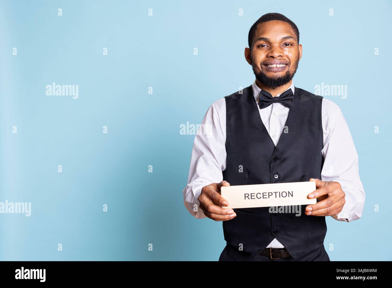 Hotel concierge presenting the reception indicator mark at front desk ...