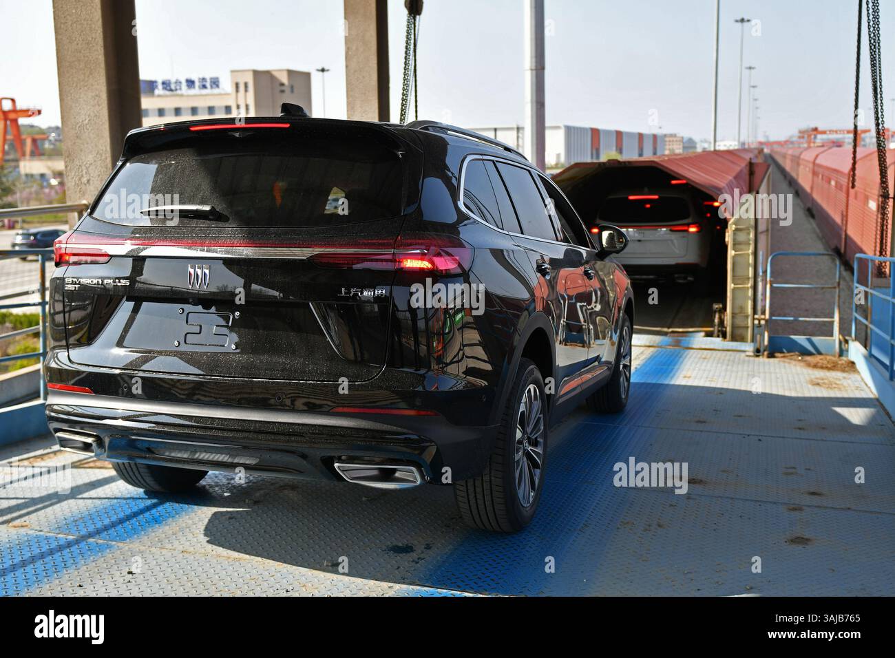 Commercial vehicles are loaded at the Yantai Logistics Park in Yantai ...
