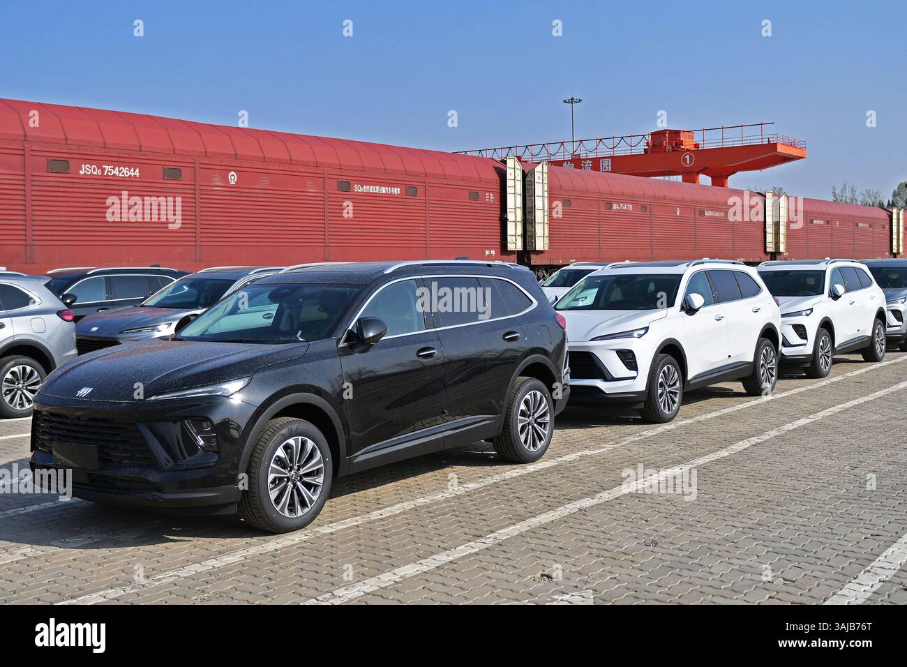 Commercial vehicles are loaded at the Yantai Logistics Park in Yantai ...
