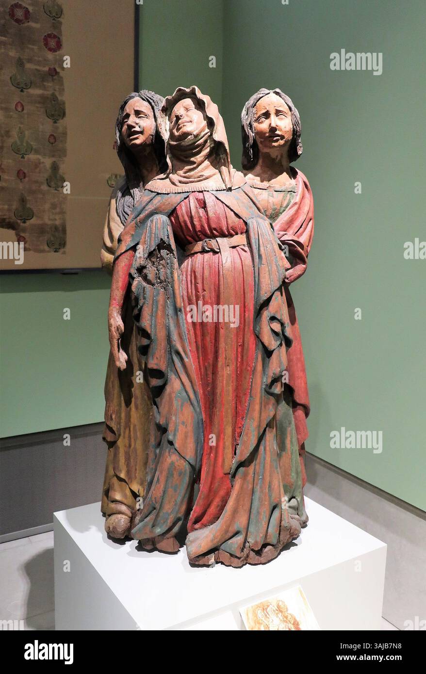 This polychrome wooden relief, 'Mary with the Mourning,' created around ...