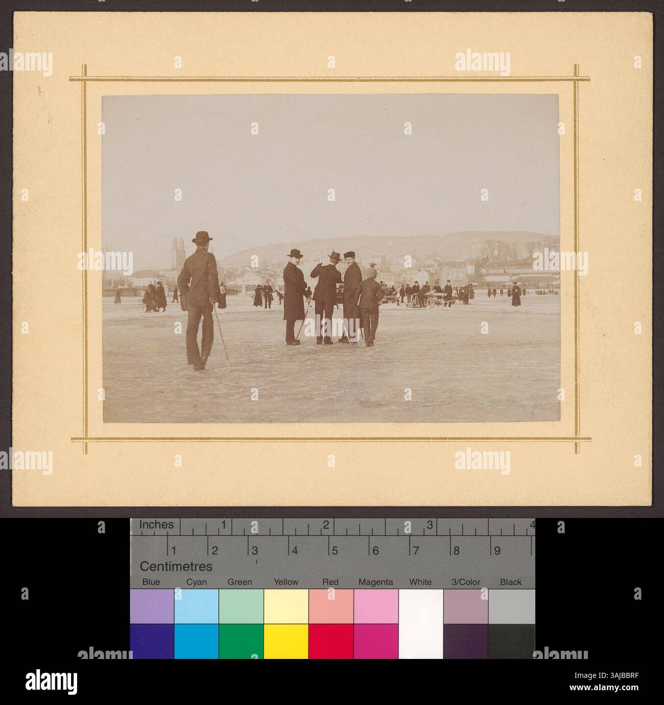 A 1891-1895 photograph of three men around a camera obscura on the ...