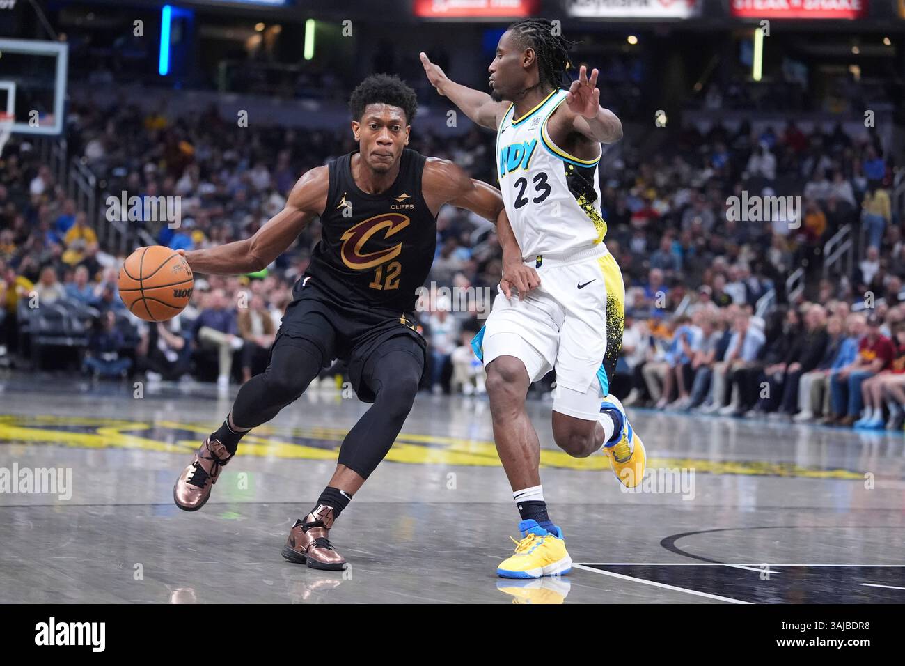 Cleveland Cavaliers forward De'Andre Hunter (12) drives on Indiana Pacers forward Aaron Nesmith ...