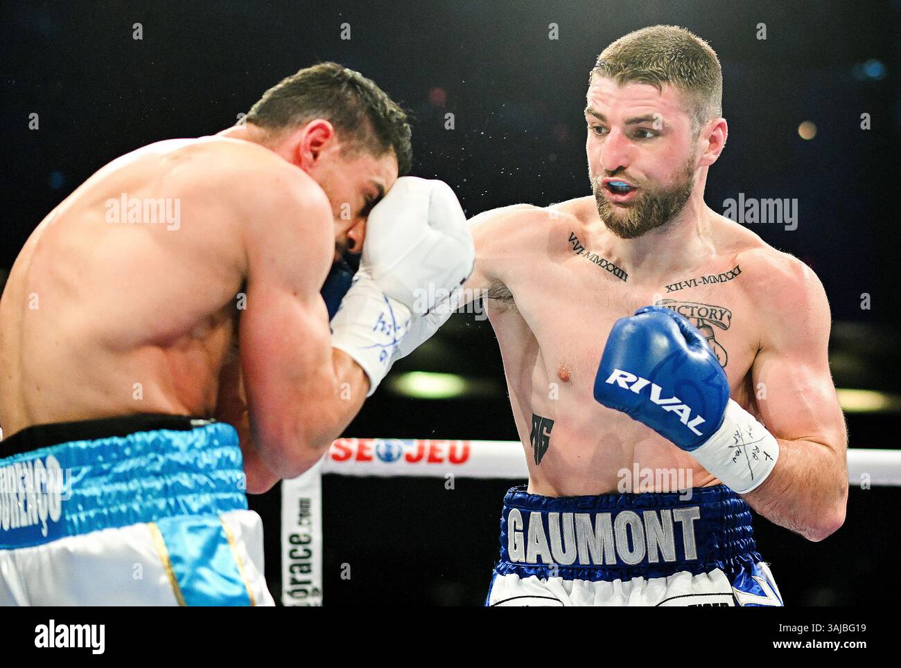 Alexandre Gaumont, right, lands a blow to Mathis Lourenco, left, during ...