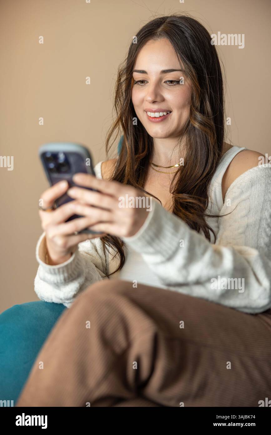 Portrait of a beautiful woman on her phone using social media apps ...