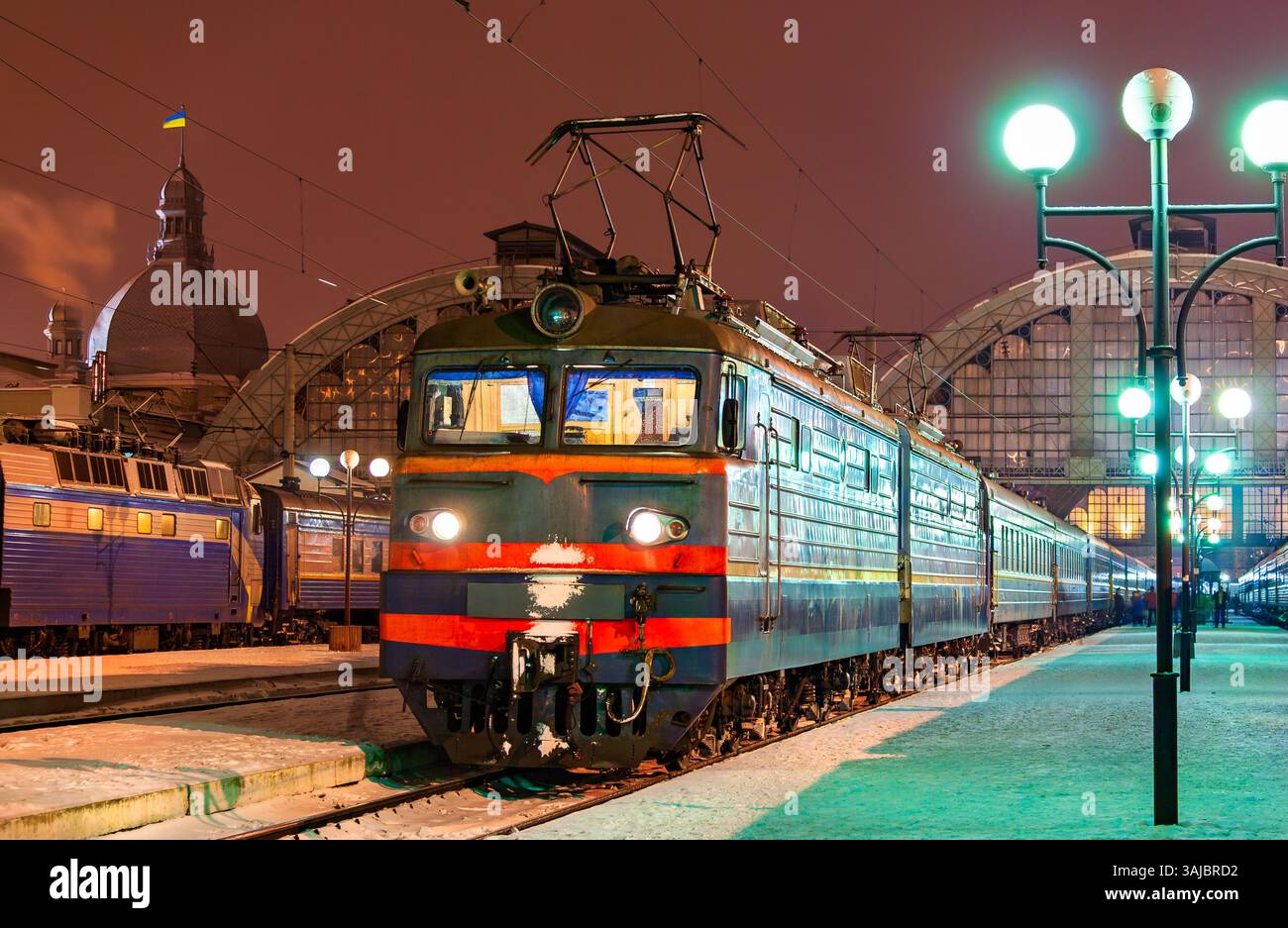 Typical Ukrainian passenger train at Lviv station with Ukraine flag on ...
