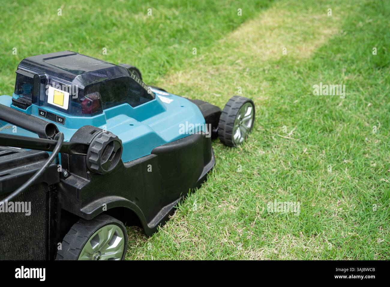 Lawn mover machine cut green grass, Hobby planting home garden Stock ...