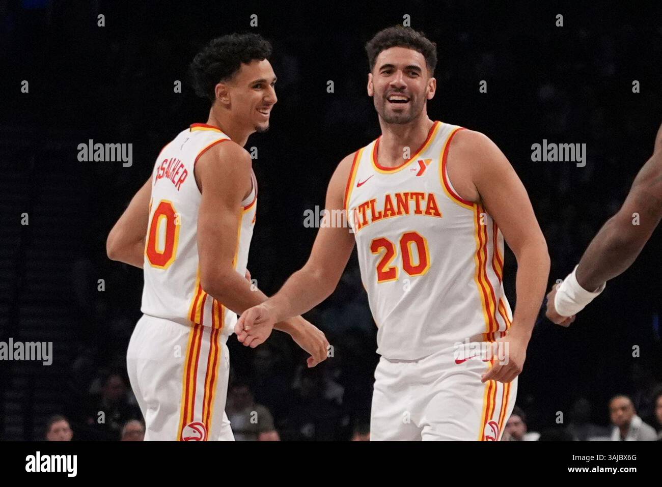 Atlanta Hawks' Zaccharie Risacher (10) celebrates with teammate Georges ...
