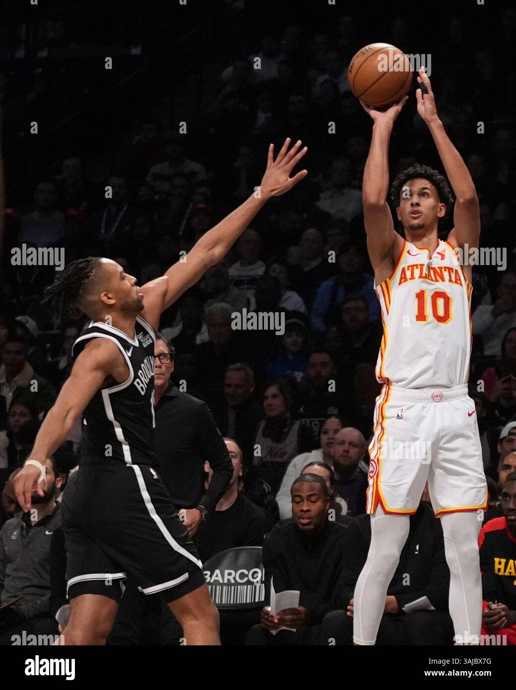 Atlanta Hawks' Zaccharie Risacher (10) shoots over Brooklyn Nets' Tosan ...