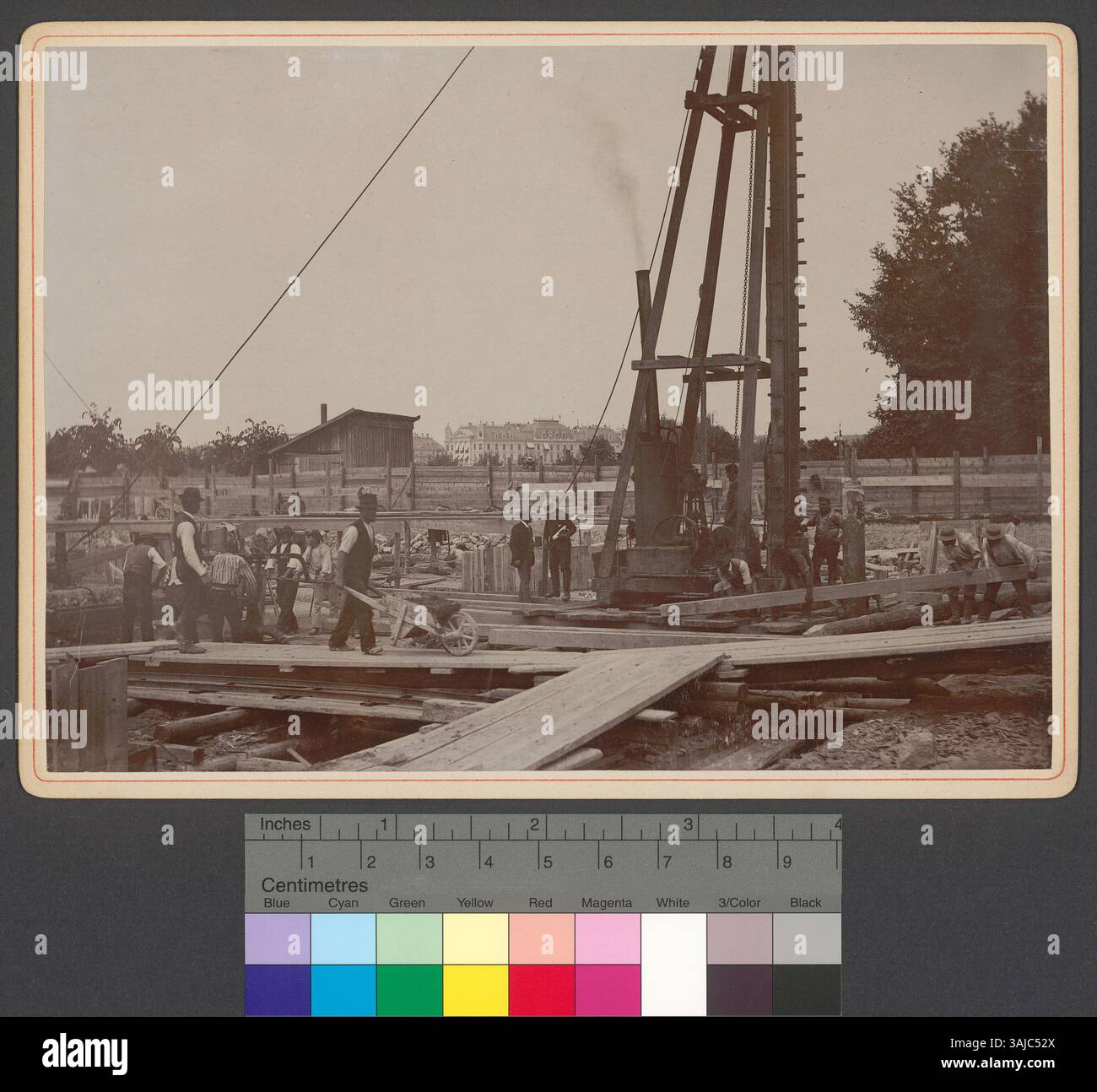 A 1890 image by Robert Breitinger showing a large, machine-powered pile ...