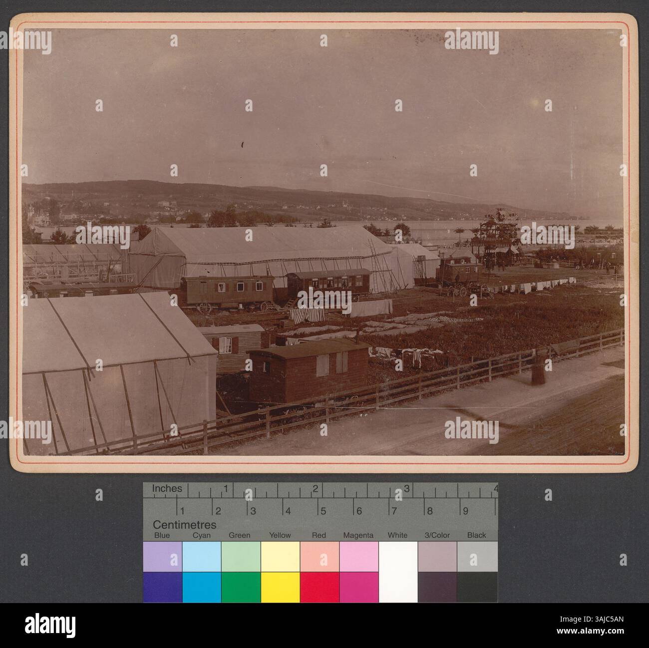 A view of a fairground scene in Enge featuring a carousel, circus ...